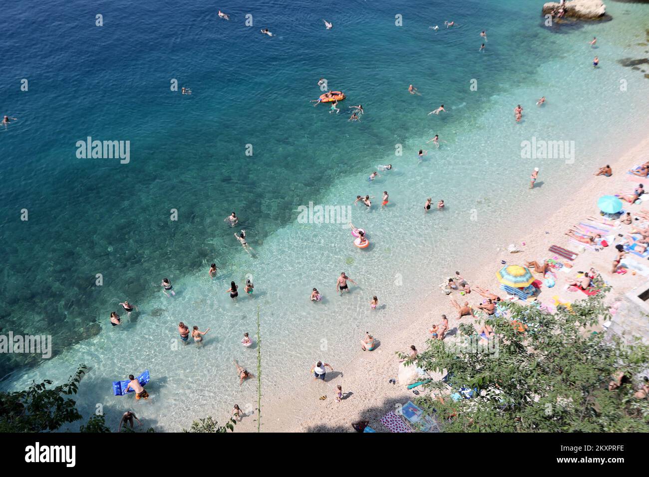 Swimmers enjoy in Sablicevo beach in Rijeka on July 24, 2021. Sablicevo ...