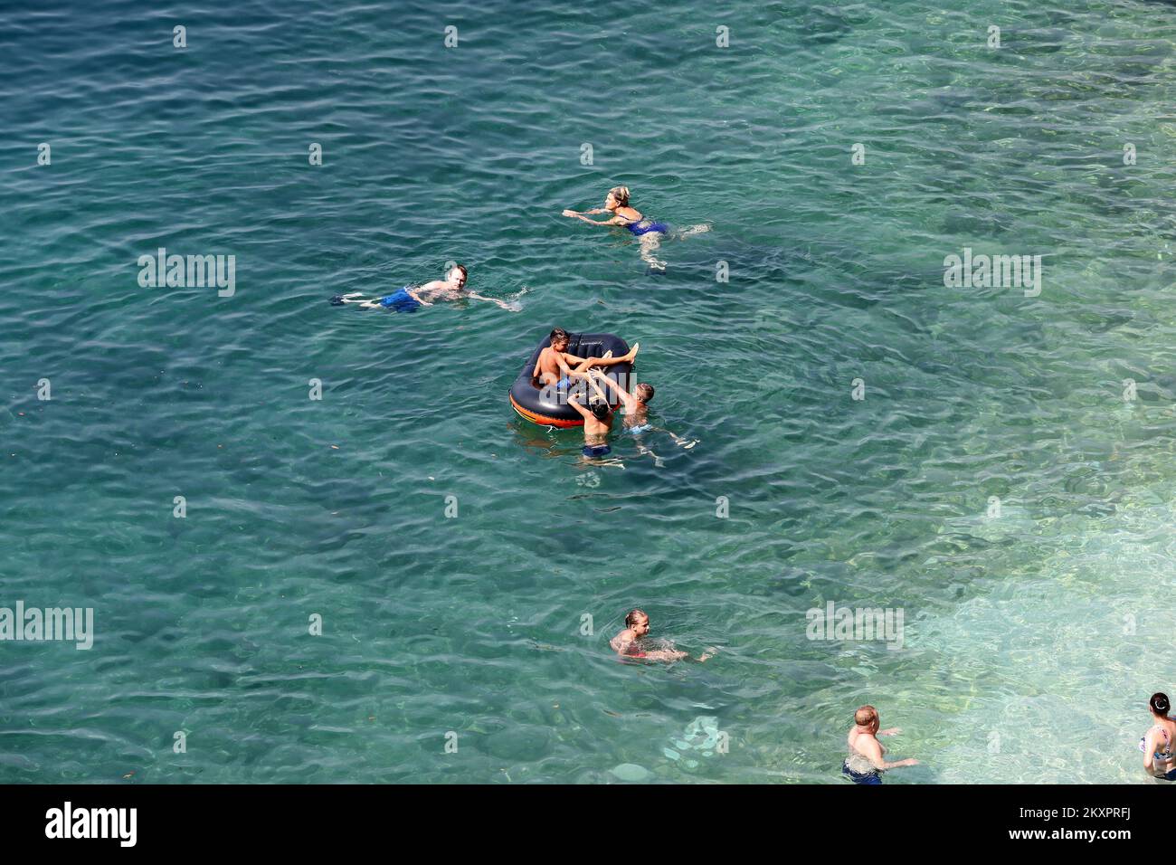 Swimmers enjoy in Sablicevo beach in Rijeka on July 24, 2021. Sablicevo ...