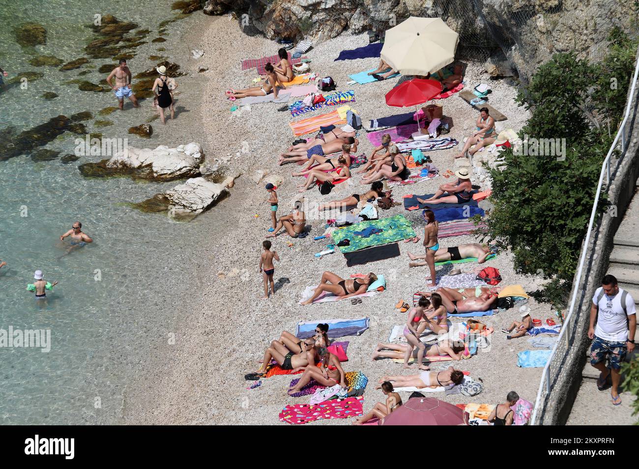 Swimmers enjoy in Sablicevo beach in Rijeka on July 24, 2021. Sablicevo ...
