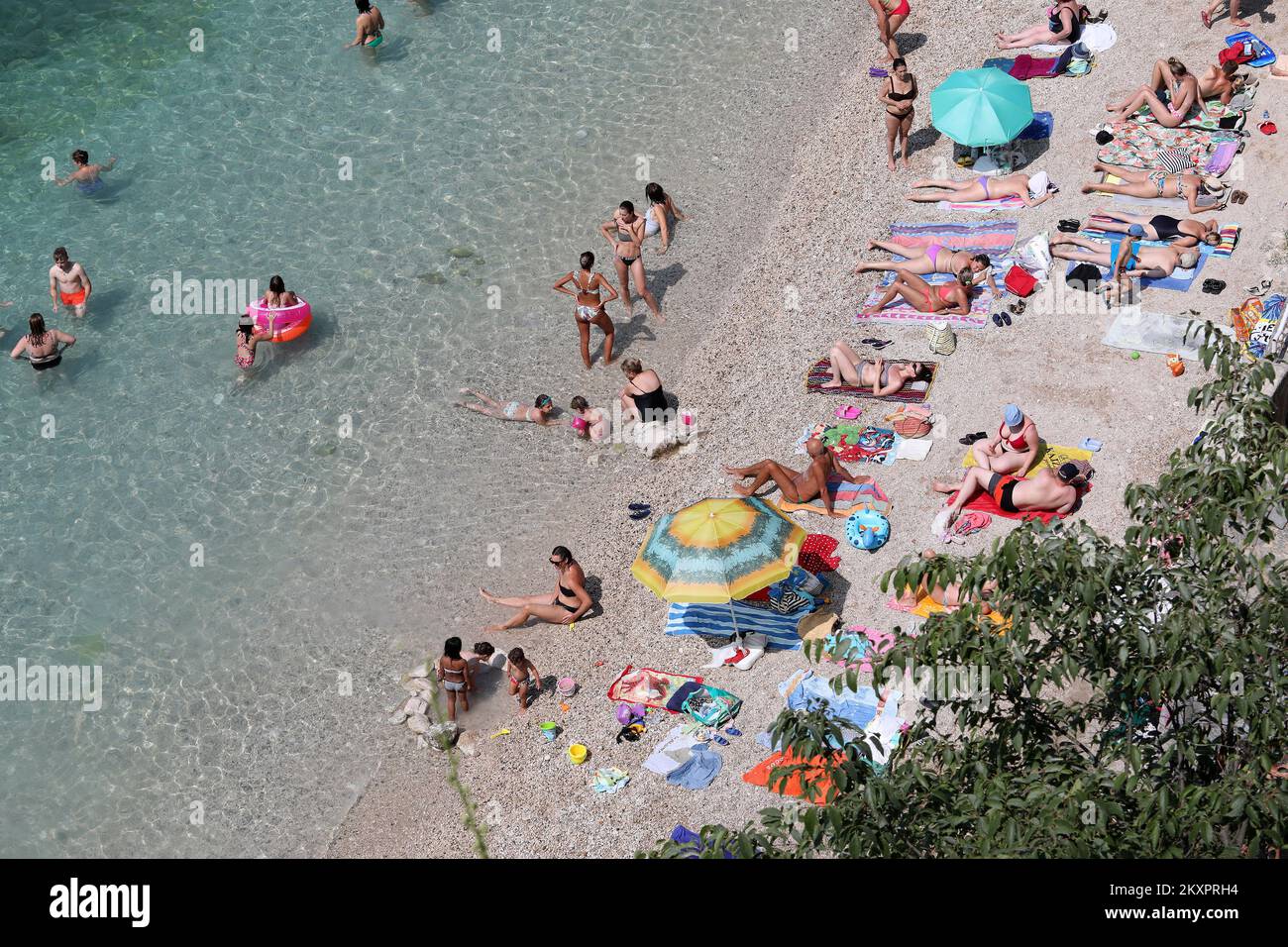 Swimmers enjoy in Sablicevo beach in Rijeka on July 24, 2021. Sablicevo ...