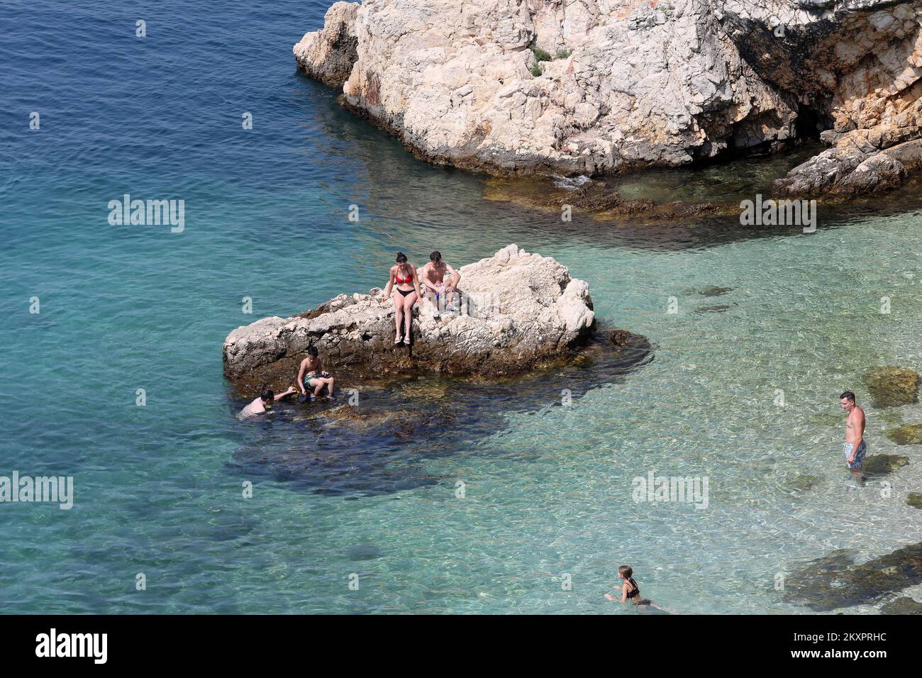 Swimmers enjoy in Sablicevo beach in Rijeka on July 24, 2021. Sablicevo ...