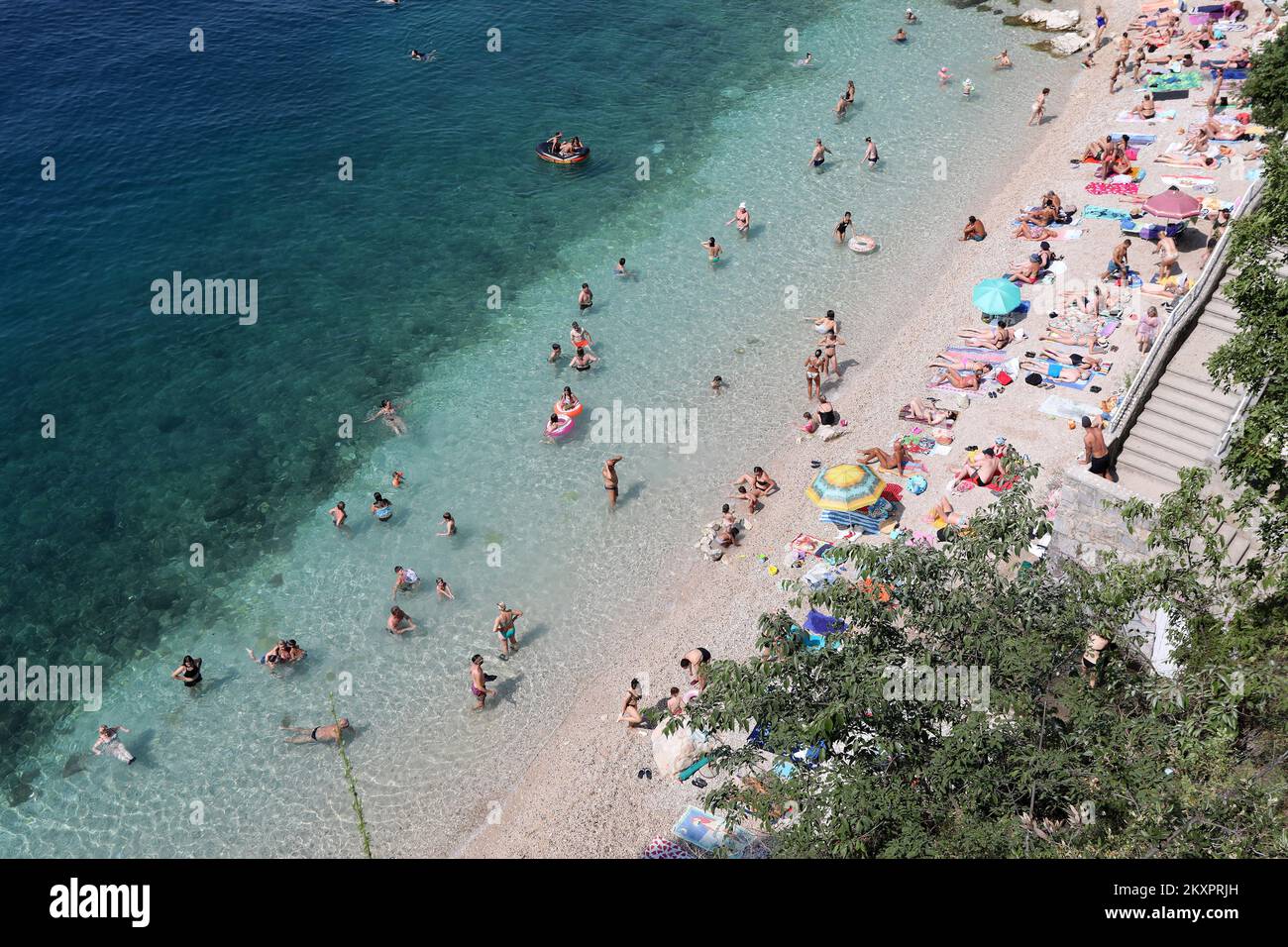 Swimmers enjoy in Sablicevo beach in Rijeka on July 24, 2021. Sablicevo is the most beautiful ...