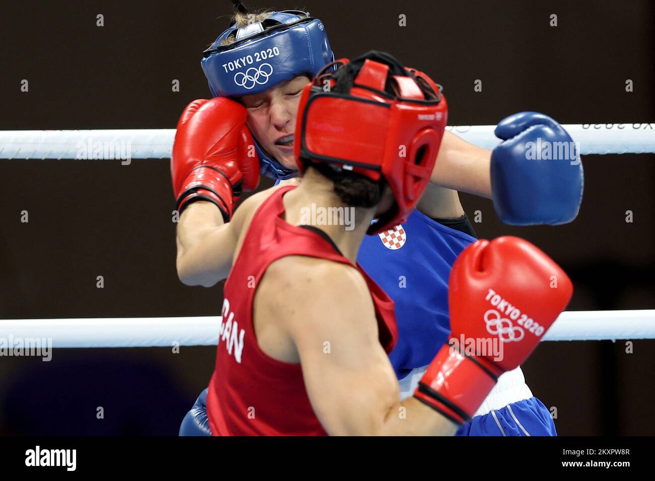 Caroline Veyre (R) of Canada exchanges punches with Nikolina Cacic (L ...