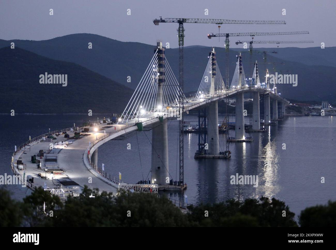 With the installation of the last, 165th segment of the steel span of ...