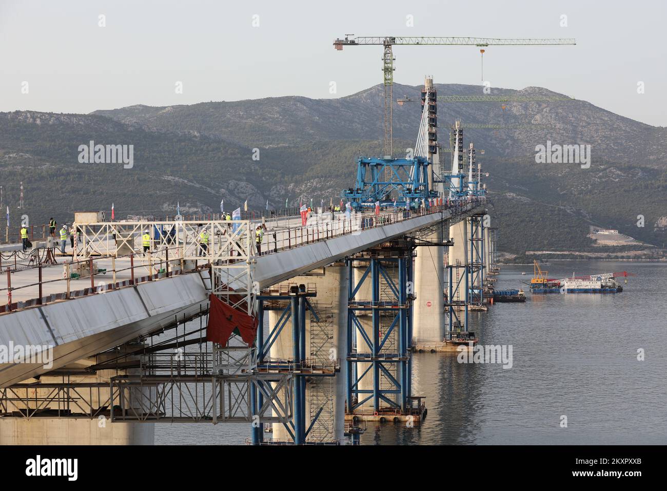 With the installation of the last, 165th segment of the steel span of ...