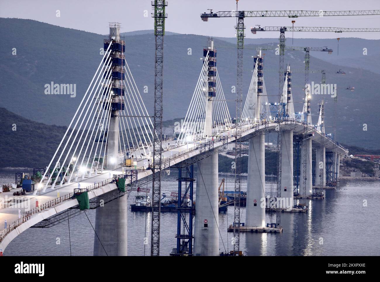 With the installation of the last, 165th segment of the steel span of ...