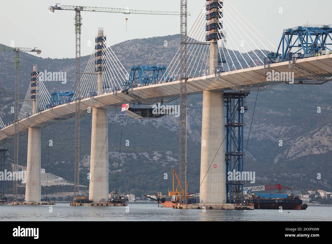 With the installation of the last, 165th segment of the steel span of ...