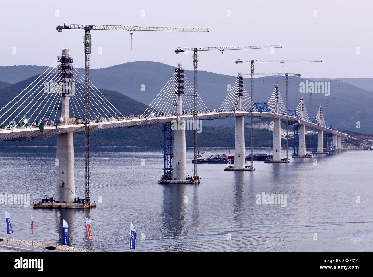 With the installation of the last, 165th segment of the steel span of ...