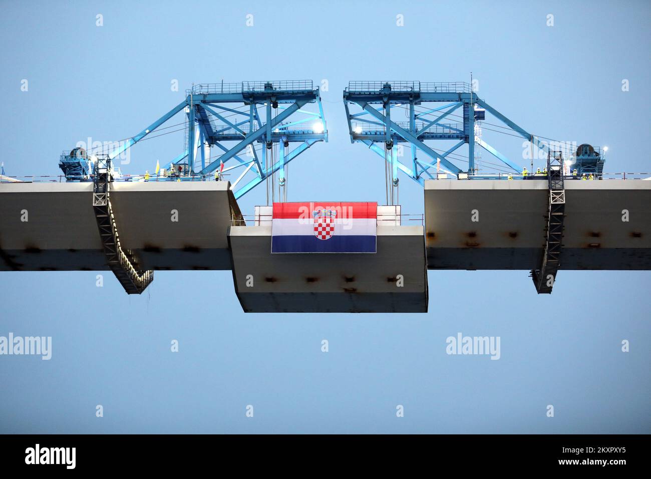 With the installation of the last, 165th segment of the steel span of ...