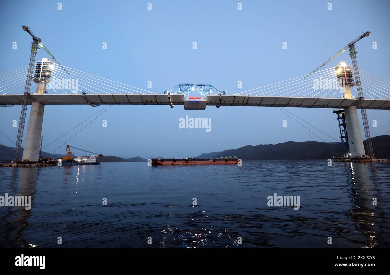 With the installation of the last, 165th segment of the steel span of ...