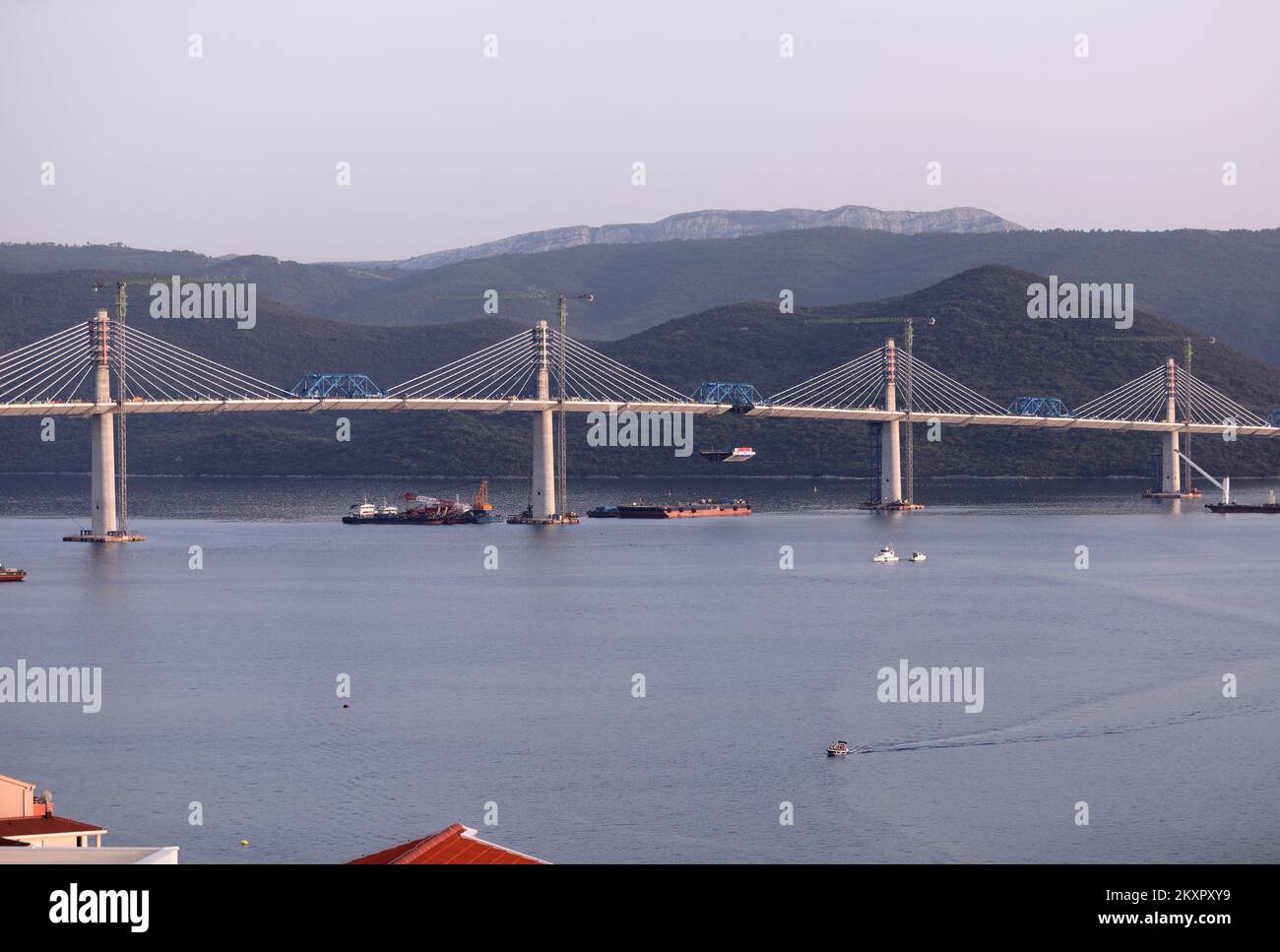 With the installation of the last, 165th segment of the steel span of ...