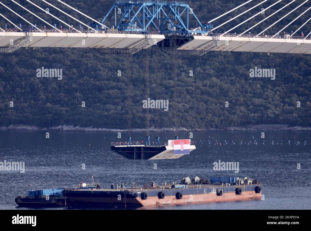 With the installation of the last, 165th segment of the steel span of ...