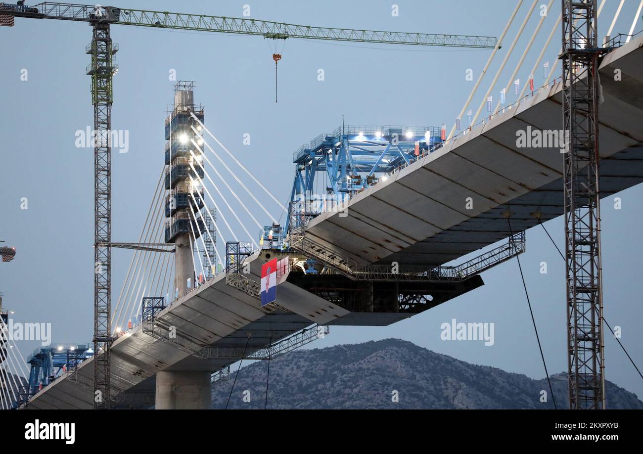 With the installation of the last, 165th segment of the steel span of ...