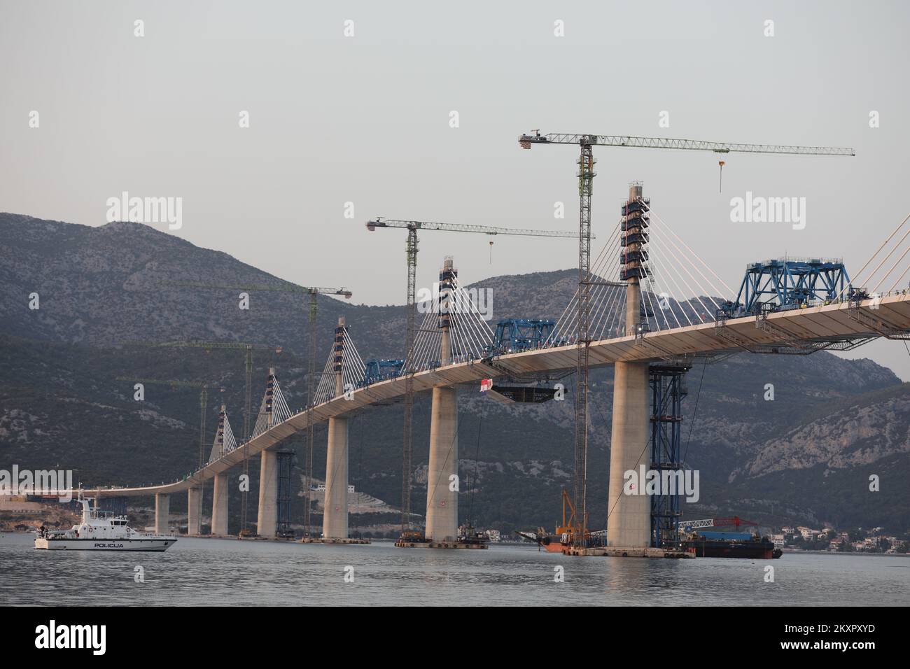 With the installation of the last, 165th segment of the steel span of ...