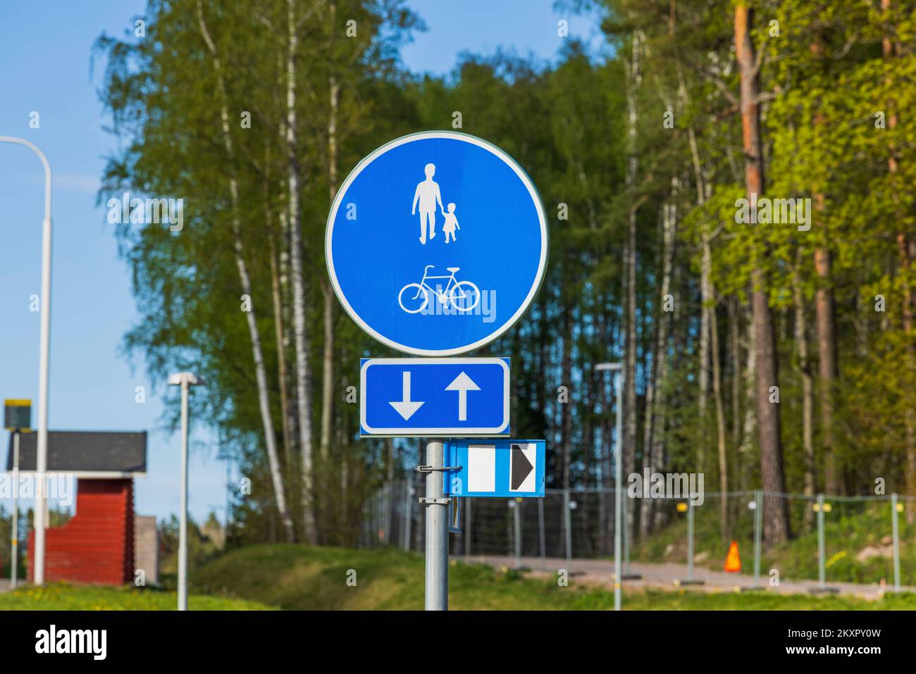 Close up view of blue road sign for pedestrians and bicycles lane ...
