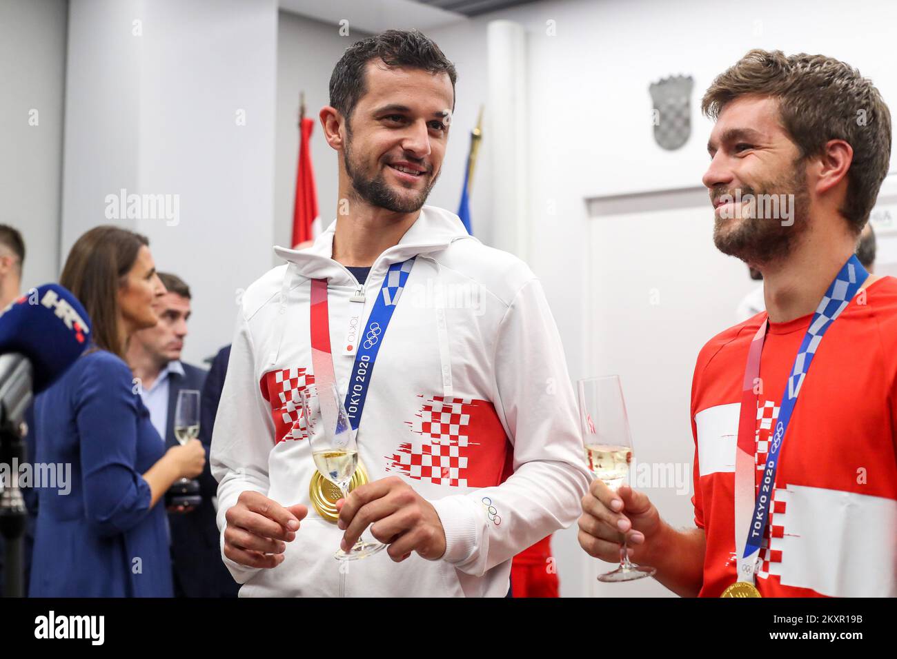 Croatian tennis players, olympic golden medalists Mate Pavic (L) and ...