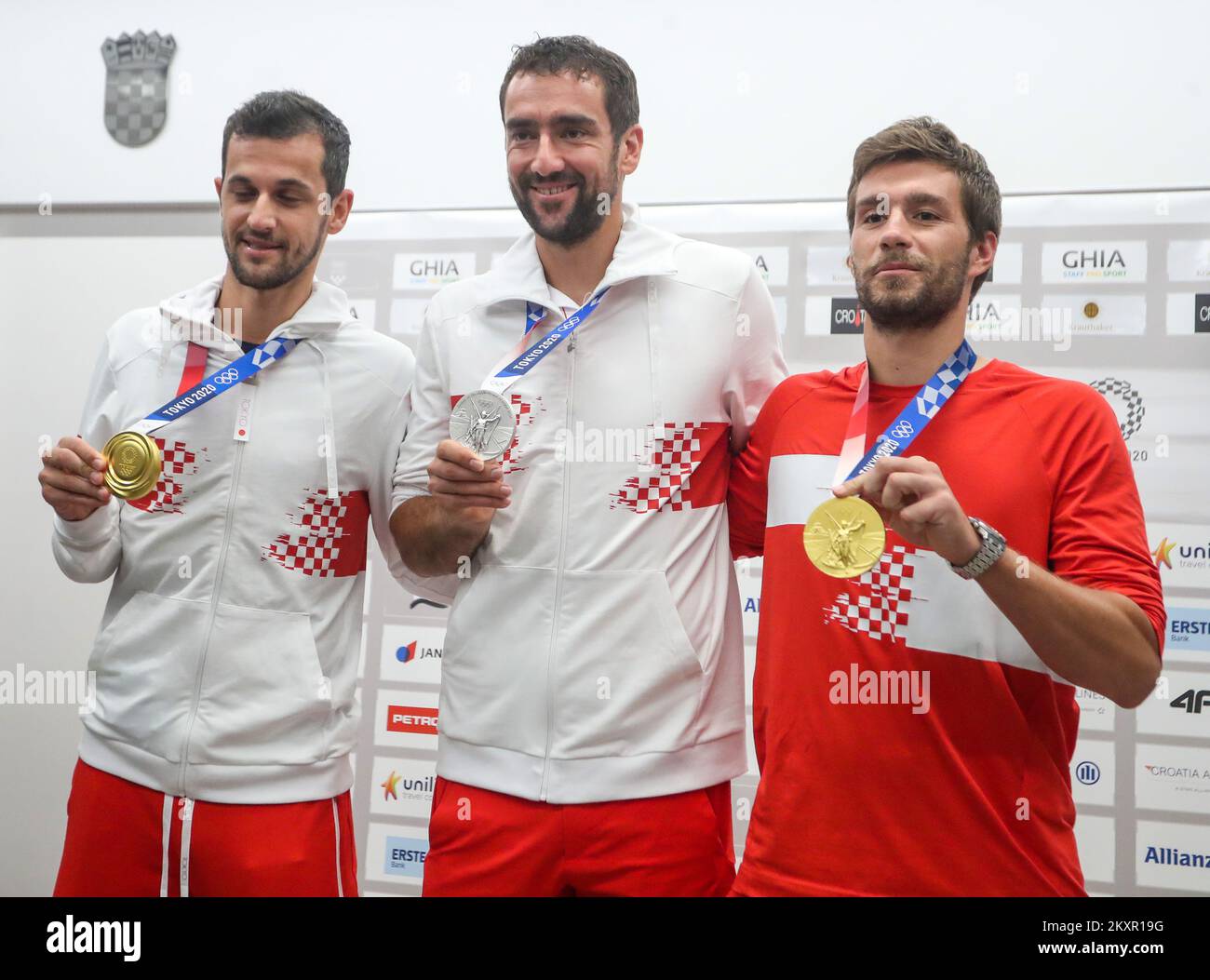 Croatian tennis players, olympic golden medalists Mate Pavic (L) and ...
