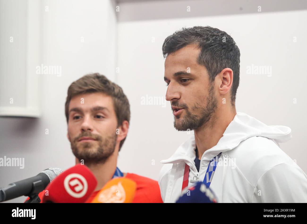 Croatian tennis players, olympic golden medalists Mate Pavic (R) and ...