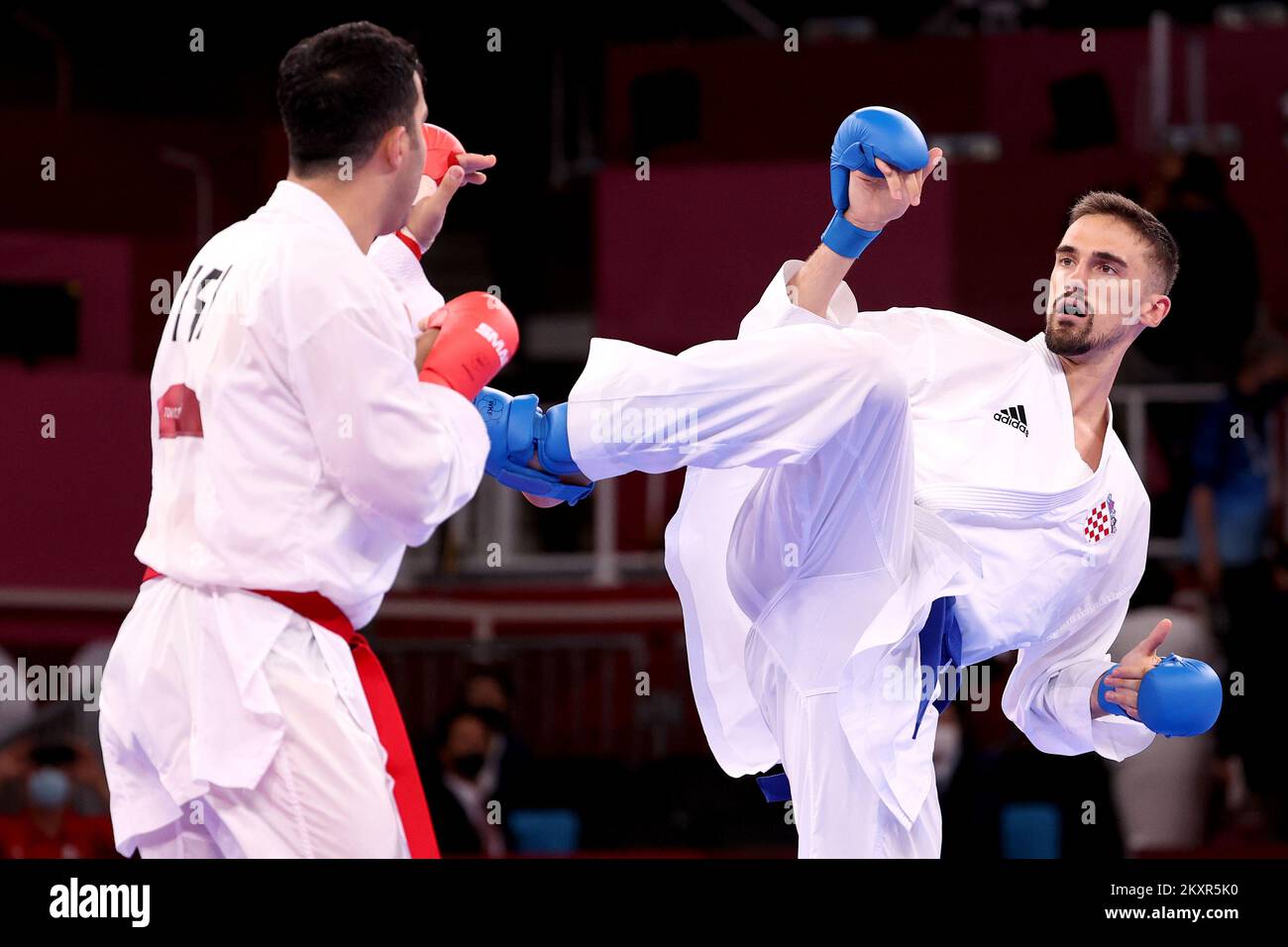 Ivan Kvesic of Team Croatia and Sajjad Ganjzadeh of Team Iran compete ...