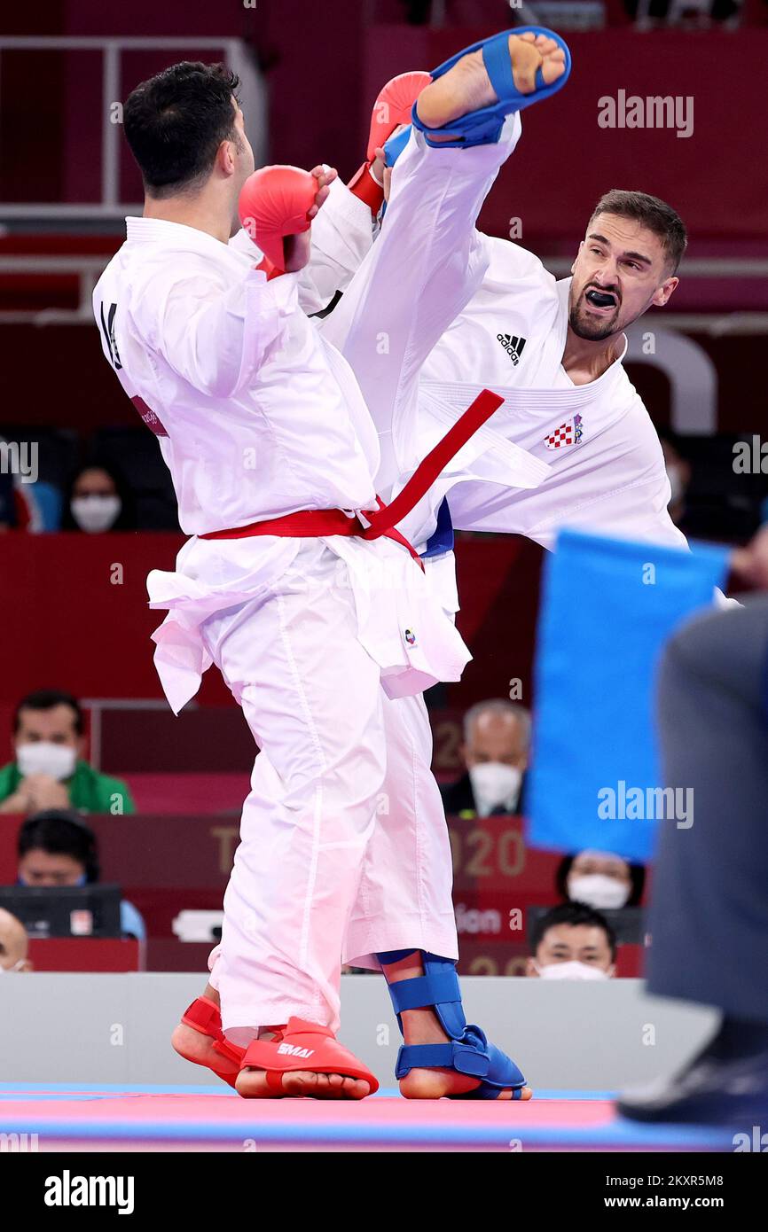 Ivan Kvesic of Team Croatia and Sajjad Ganjzadeh of Team Iran compete ...