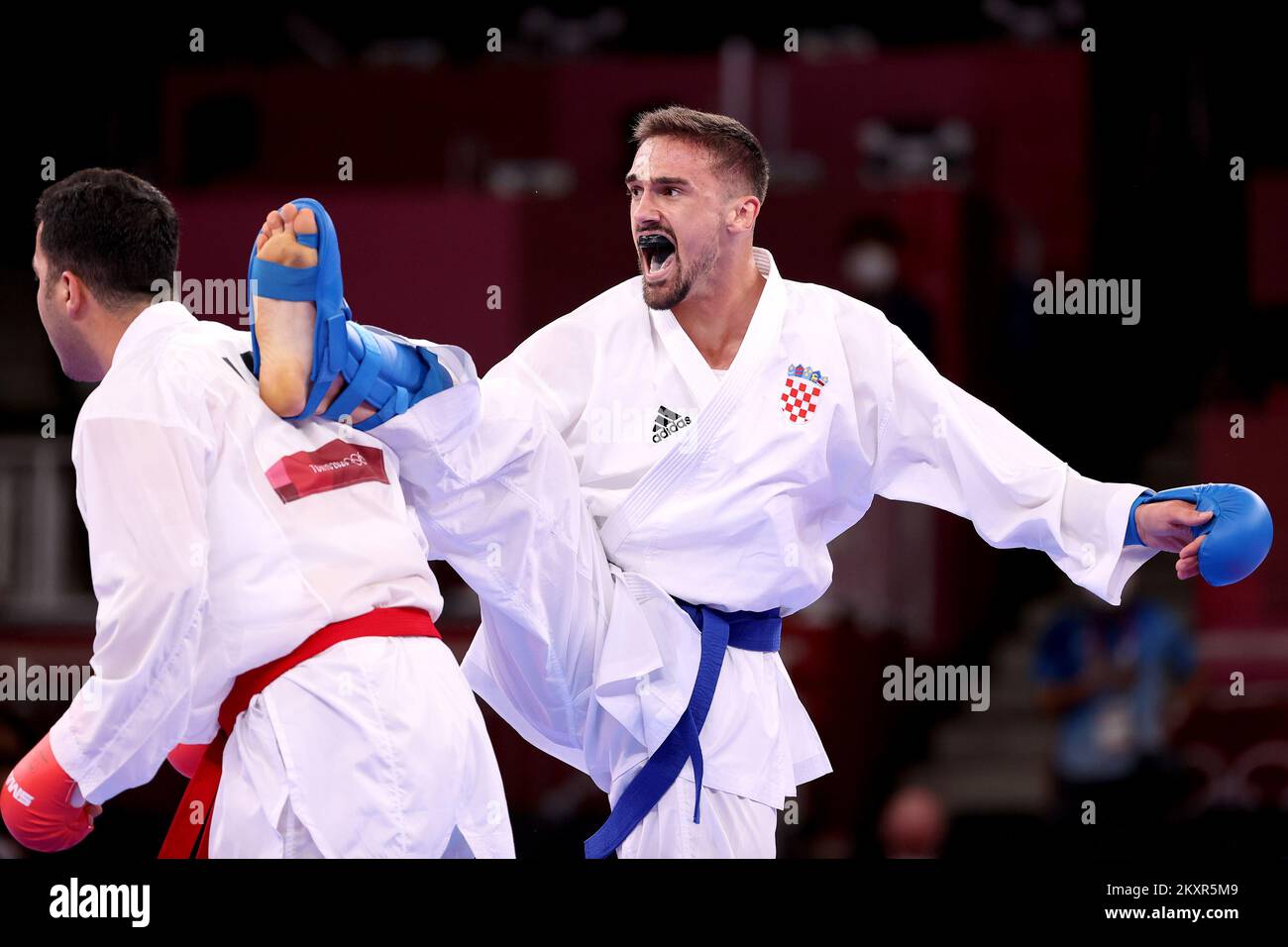 Ivan Kvesic of Team Croatia and Sajjad Ganjzadeh of Team Iran compete ...