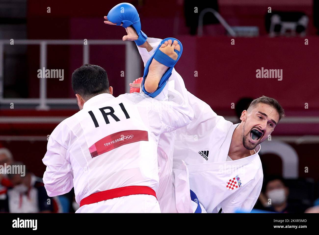 Ivan Kvesic of Team Croatia and Sajjad Ganjzadeh of Team Iran compete ...