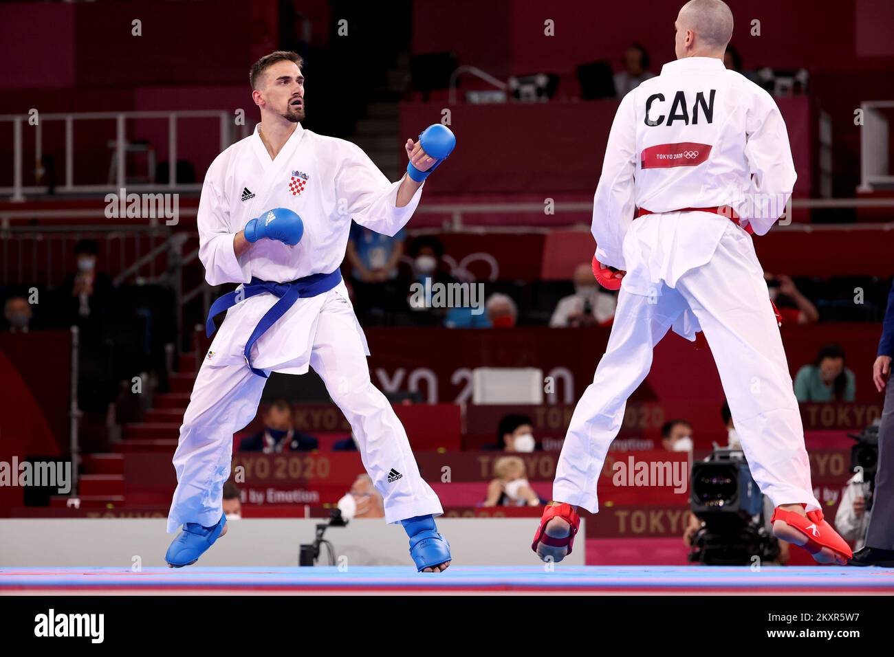 Ivan Kvesic of Team Croatia and Daniel Gaysinsky of Team Canada compete ...