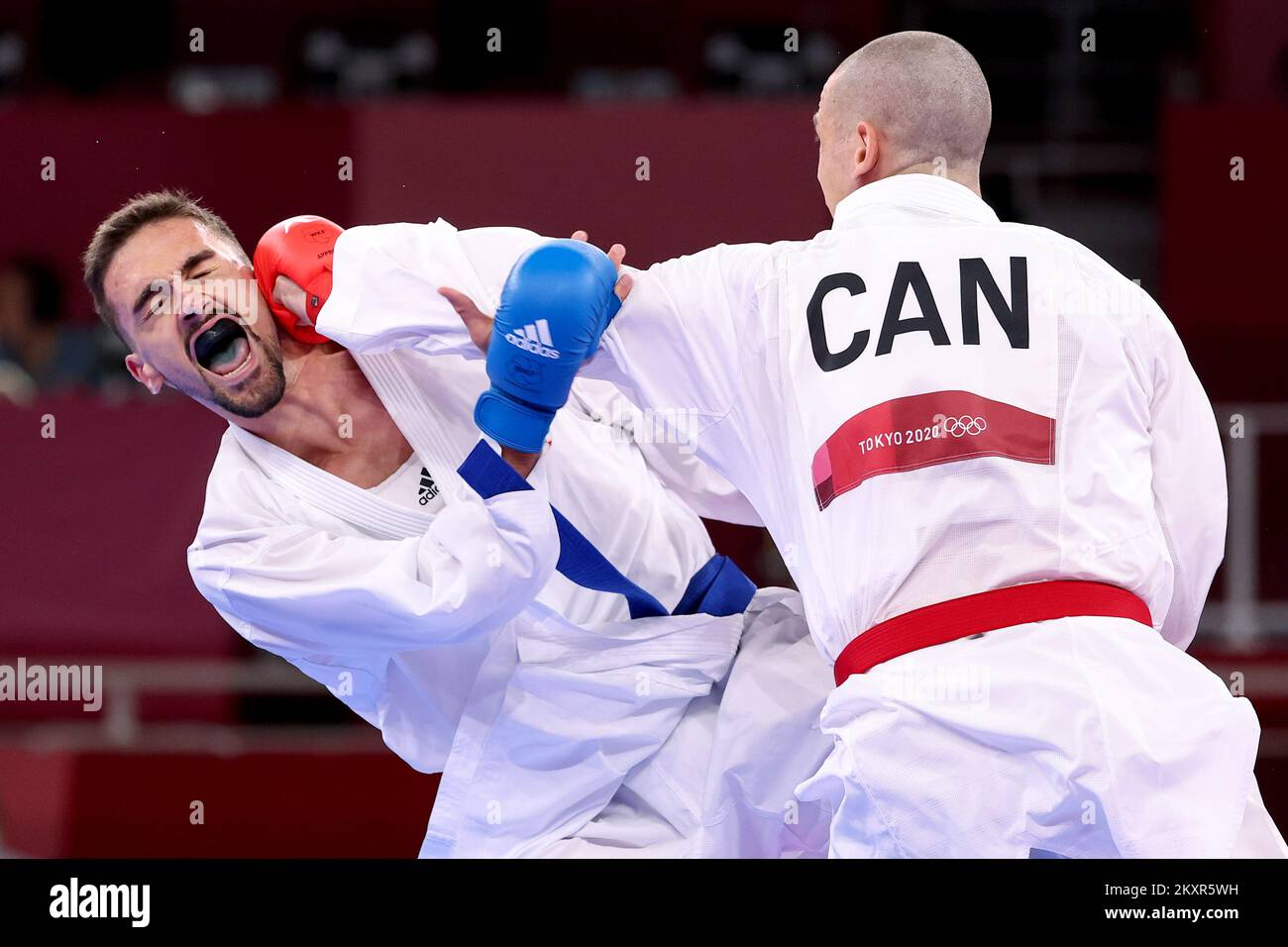 Ivan Kvesic of Team Croatia and Daniel Gaysinsky of Team Canada compete ...