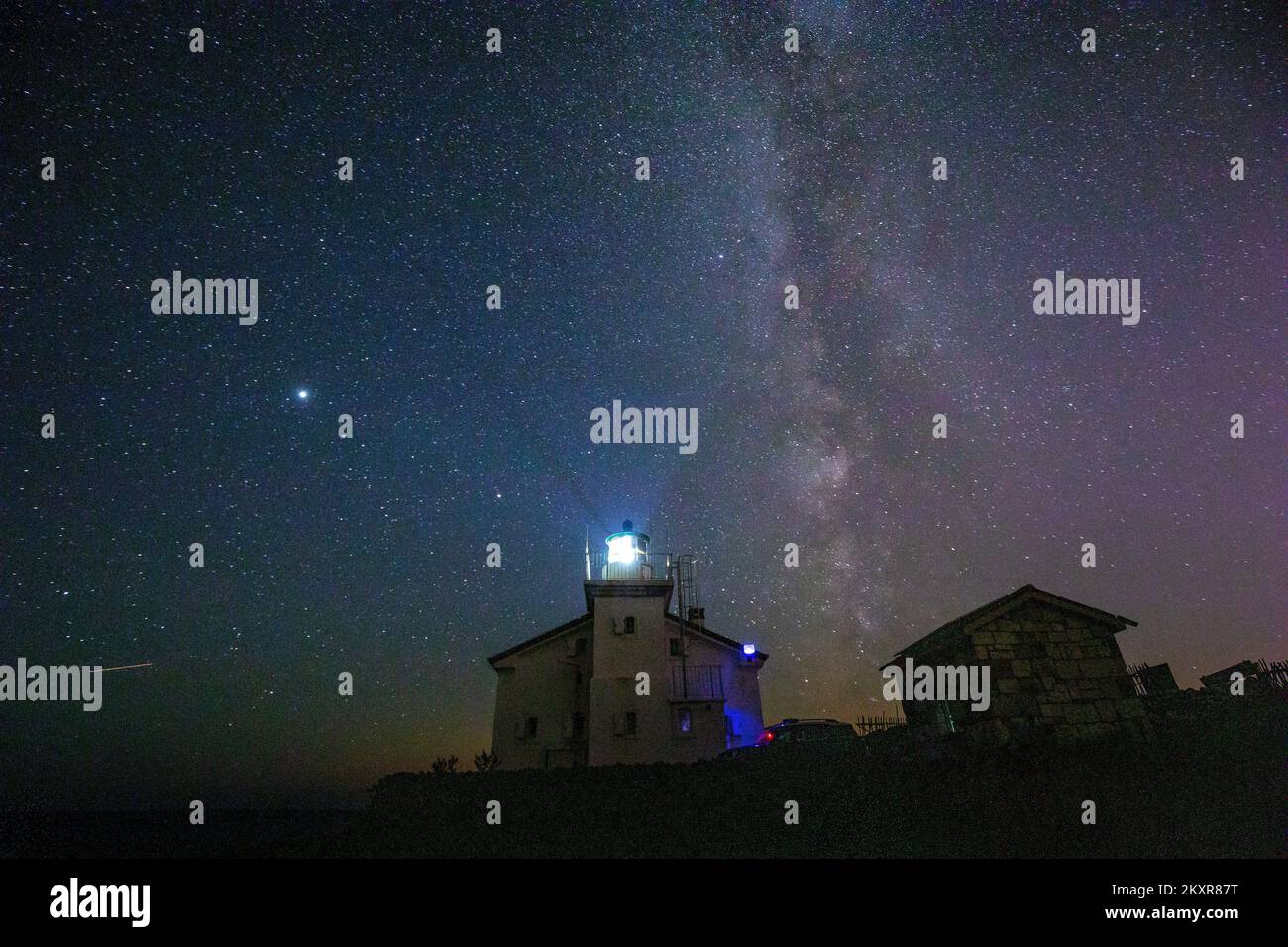 Perseids in the night sky photographed near the lighthouse Rt Marlera ...