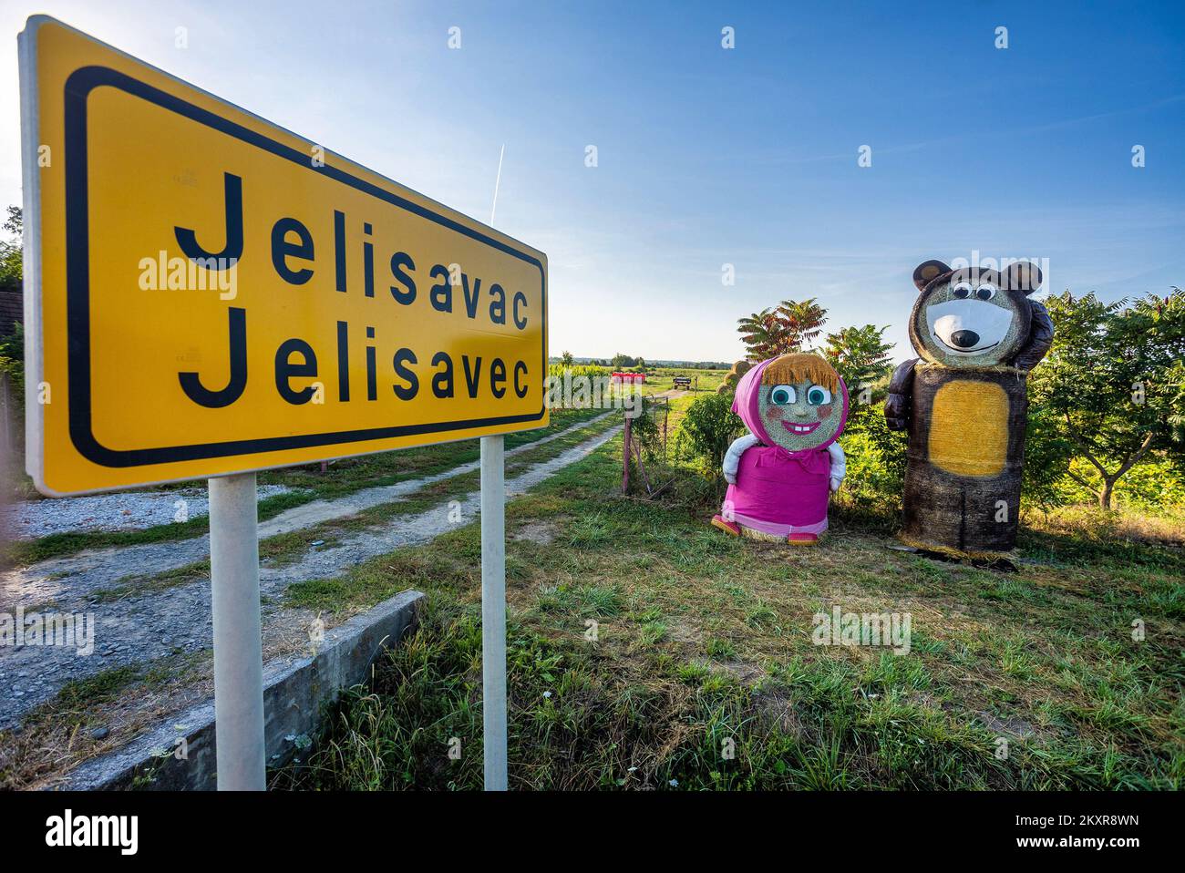 Cartoon characters Masha and the Bear made of hay bales seen at the ...
