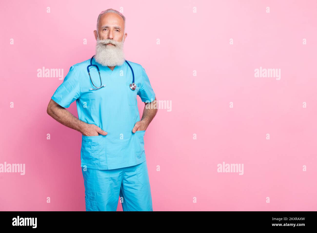 Photo of confident qualified doctor put hands in coat ready examine ...