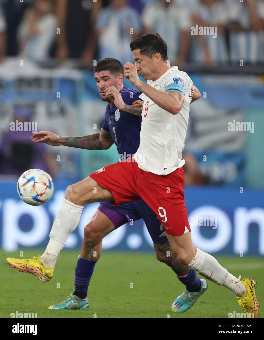 Doha, Qatar. 30th Nov, 2022. Robert Lewandowski (R) of Poland vies with ...