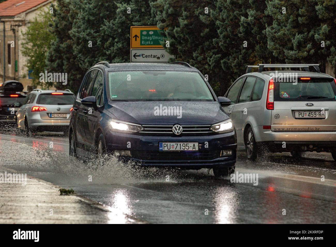 Traffic during heavy rain and clouds after few weaks of heat above city ...