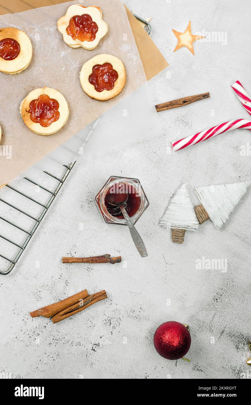 Linzer cookie making process . Christmas cookies filled with jam and ...