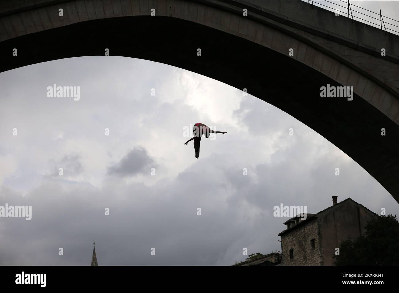 The contestant jumps from the Old Bridge as part of the Red Bull Cliff ...