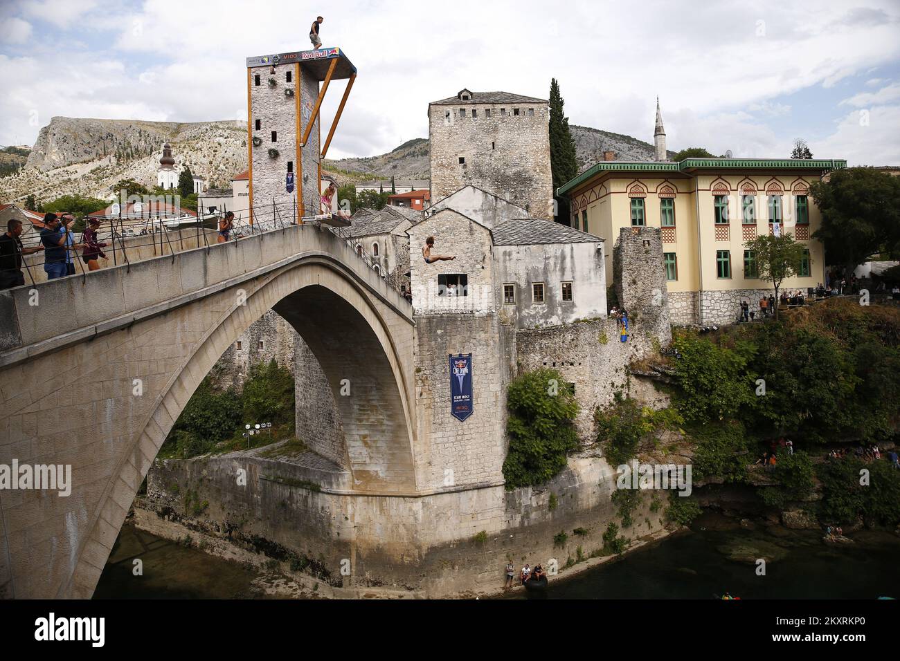 The competitor jumps from the Old Bridge as part of the Red Bull Cliff ...