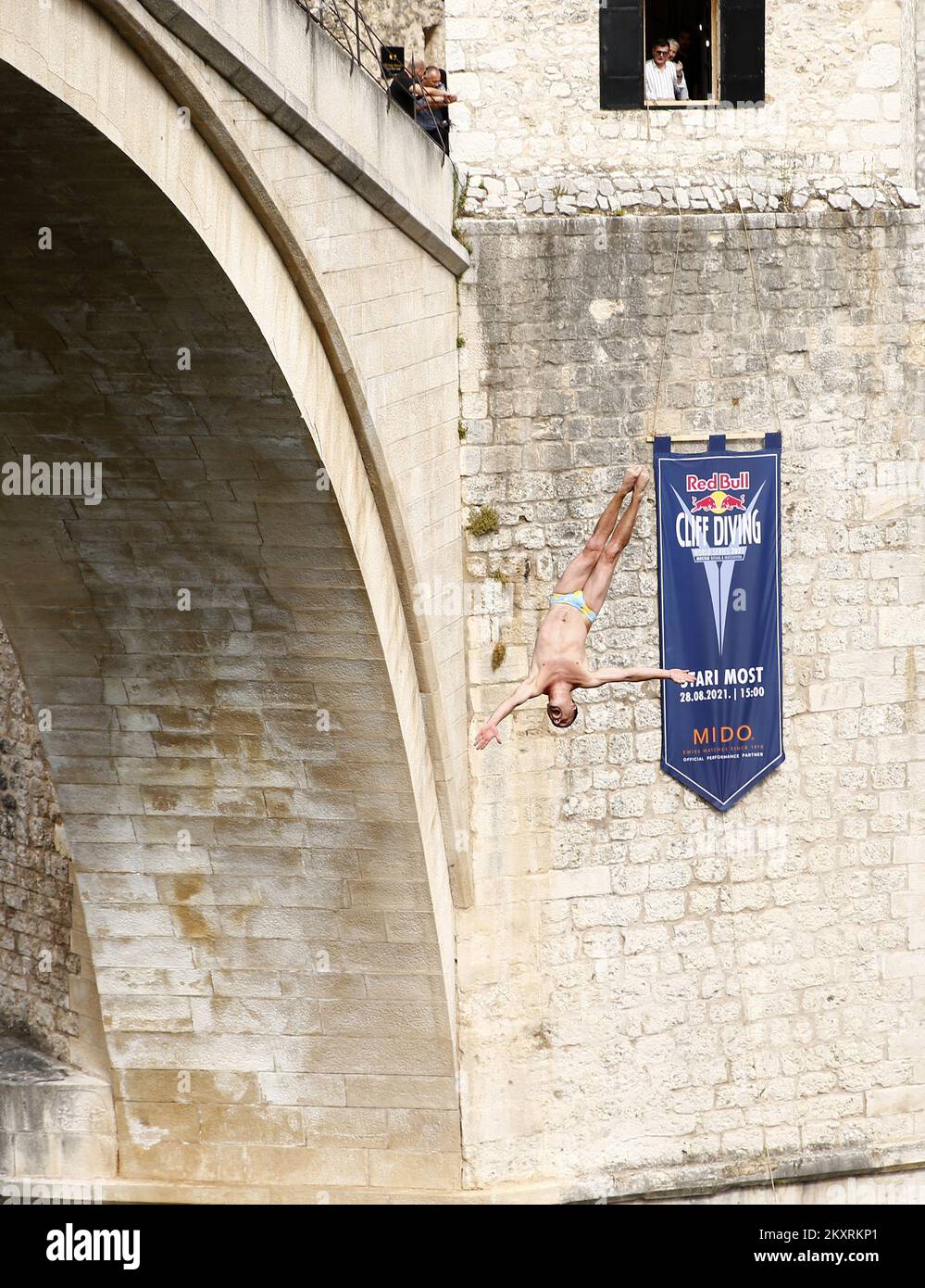 The competitor jumps from the Old Bridge as part of the Red Bull Cliff ...