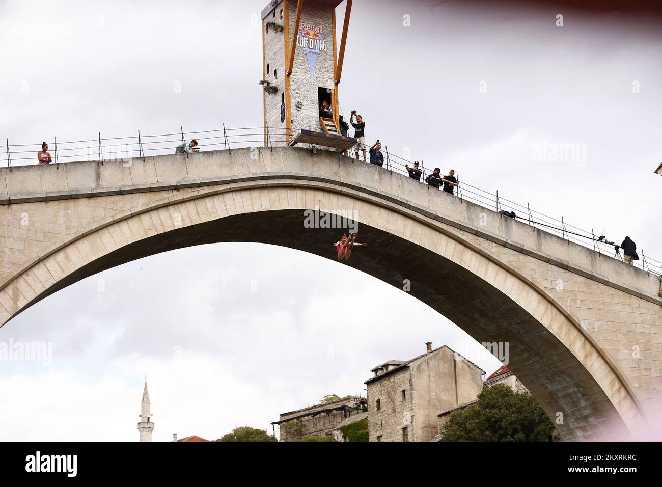 The competitor jumps from the Old Bridge as part of the Red Bull Cliff ...