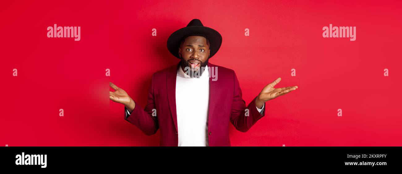 Image of confused Black man asking question, spread hands sideways and ...