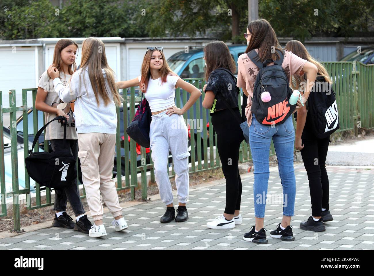 Children arrive at school on the first day of the new school year after ...