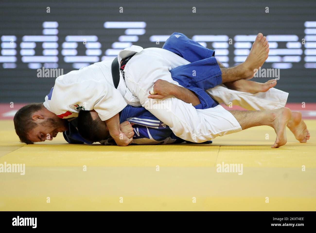 Matan Kokolayev of Israel (blue) and Samuel Hall of Great Britain ...