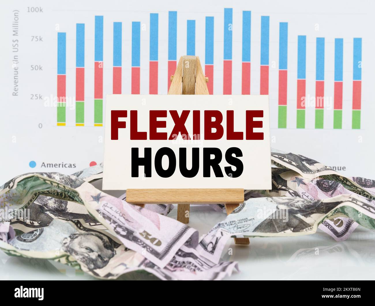 Business and finance concept. Among financial charts and money is a ...