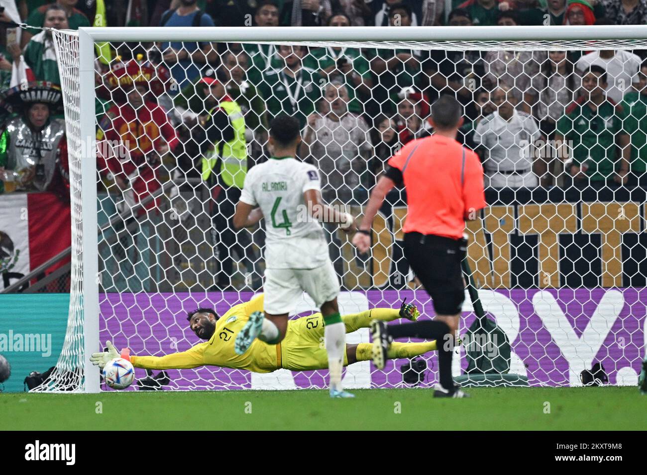 Lusail, Qatar. 30th Nov, 2022. Mohammed Alowais (below), goalkeeper of ...