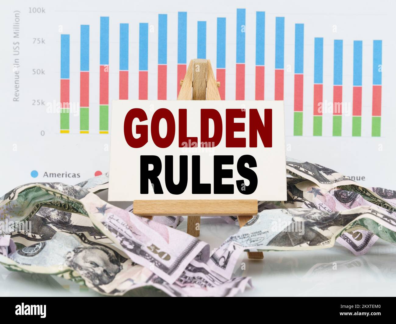 Business and finance concept. Among financial charts and money is a ...