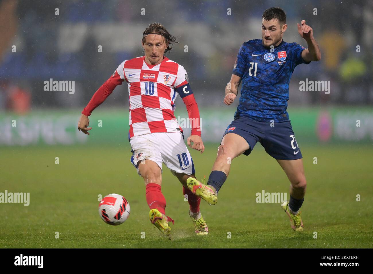 Luka Modric of Croatia and Matus Bero of Slovakia in action during the ...