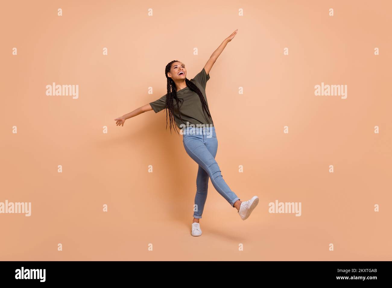 Full body photo of overjoyed cheerful person dancing raise hands toothy ...