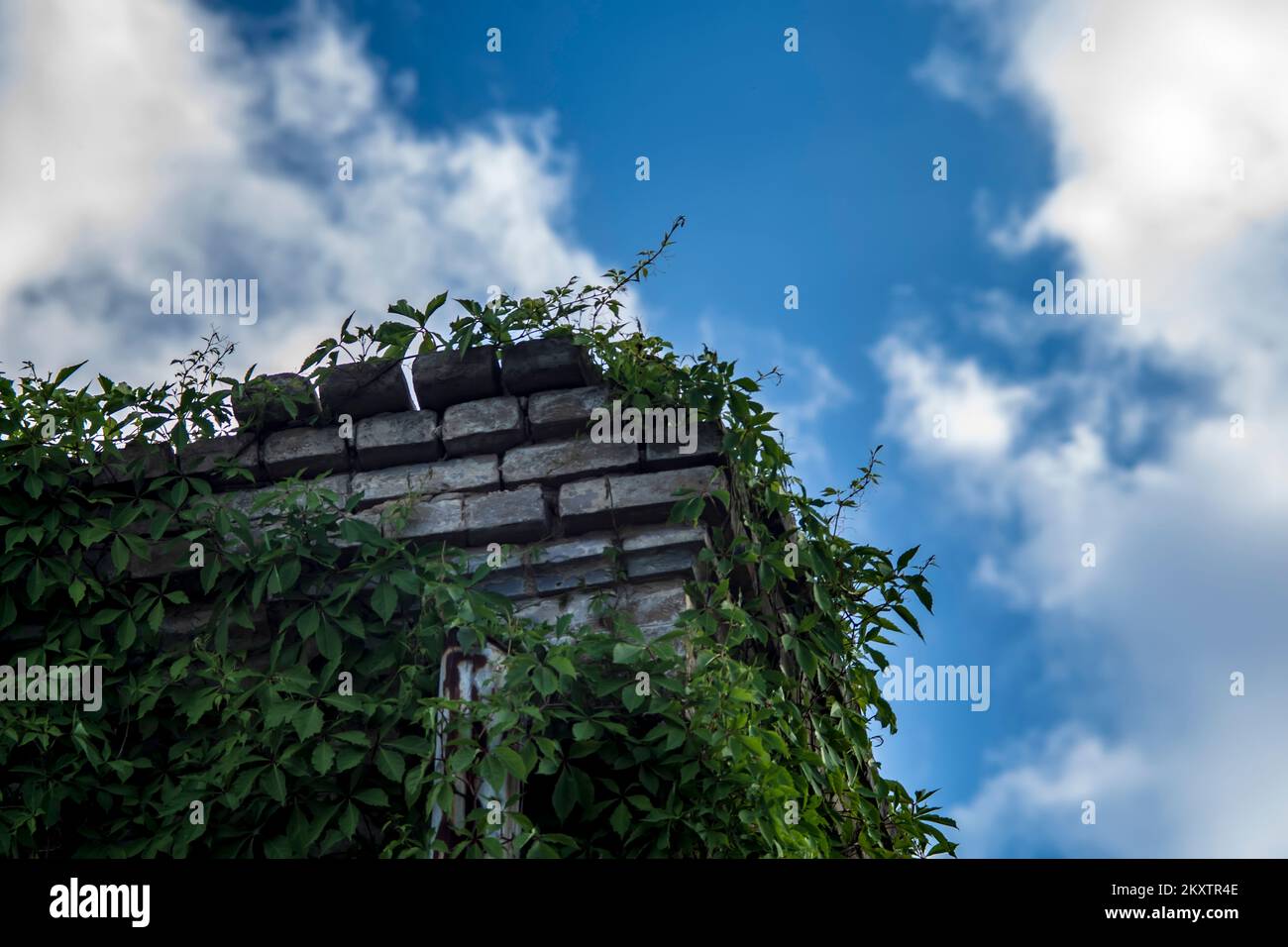 The corner of old house on sky background Stock Photo - Alamy