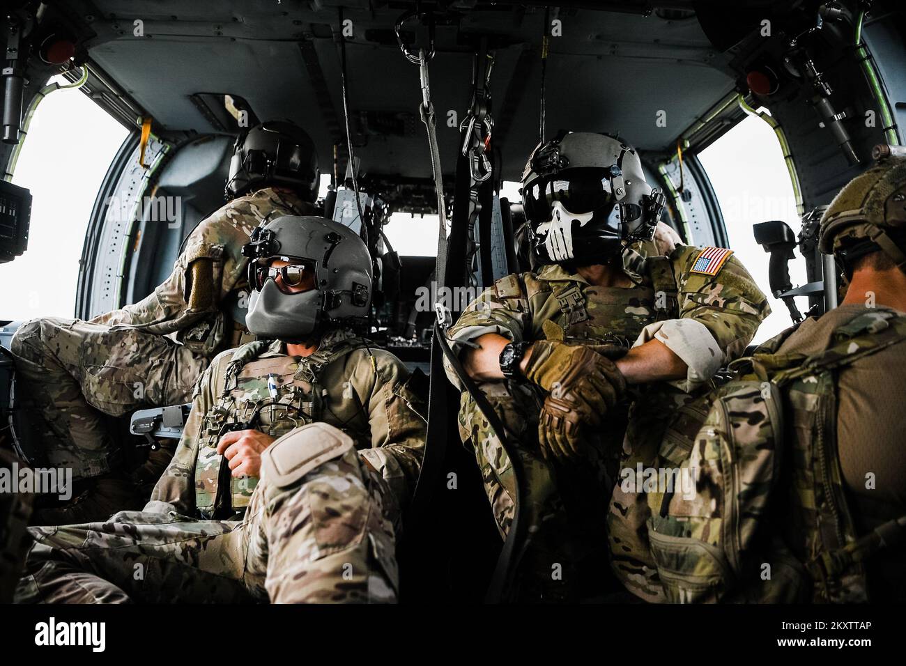 Aircrew members of a U.S. Air Force HH-60W Jolly Green II helicopter ...