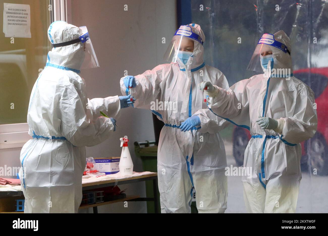 A medical member packs a test tube containing nucleic acid samples at ...