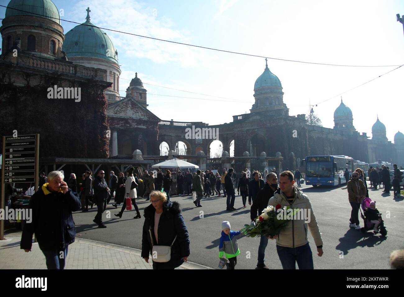 People visit the graves of their loved ones during All Saints Day at ...